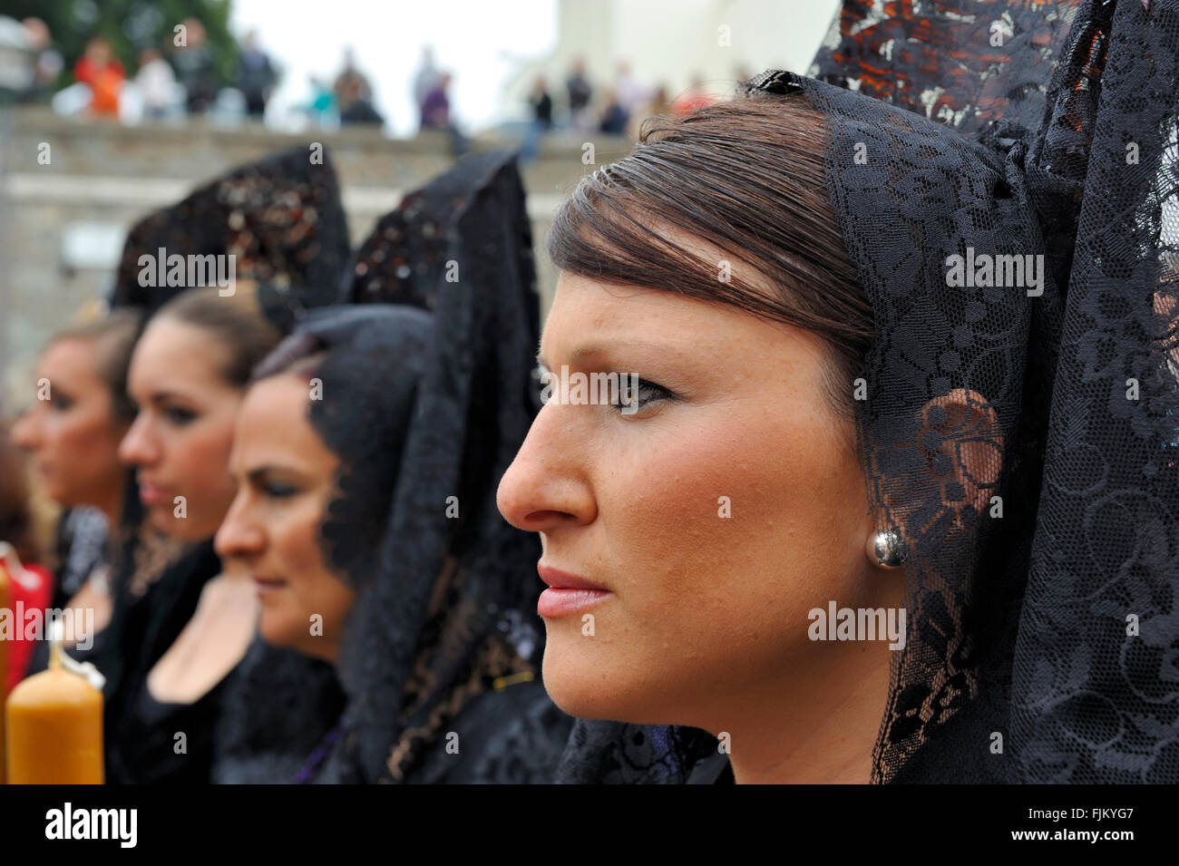 Four Spanish women wearing a traditional Spanish "mantilla" that is a ...