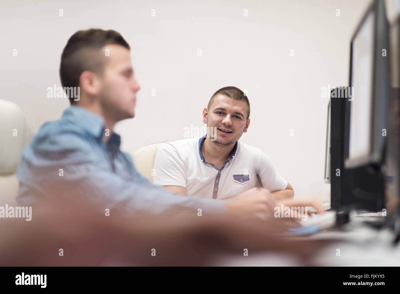 photo editors working with graphic tablet and pen on photographs in retouching studio Stock ...