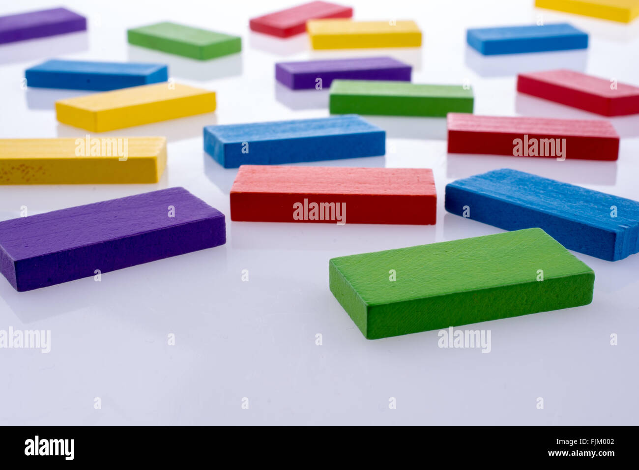 Color dominoes on a white background Stock Photo - Alamy