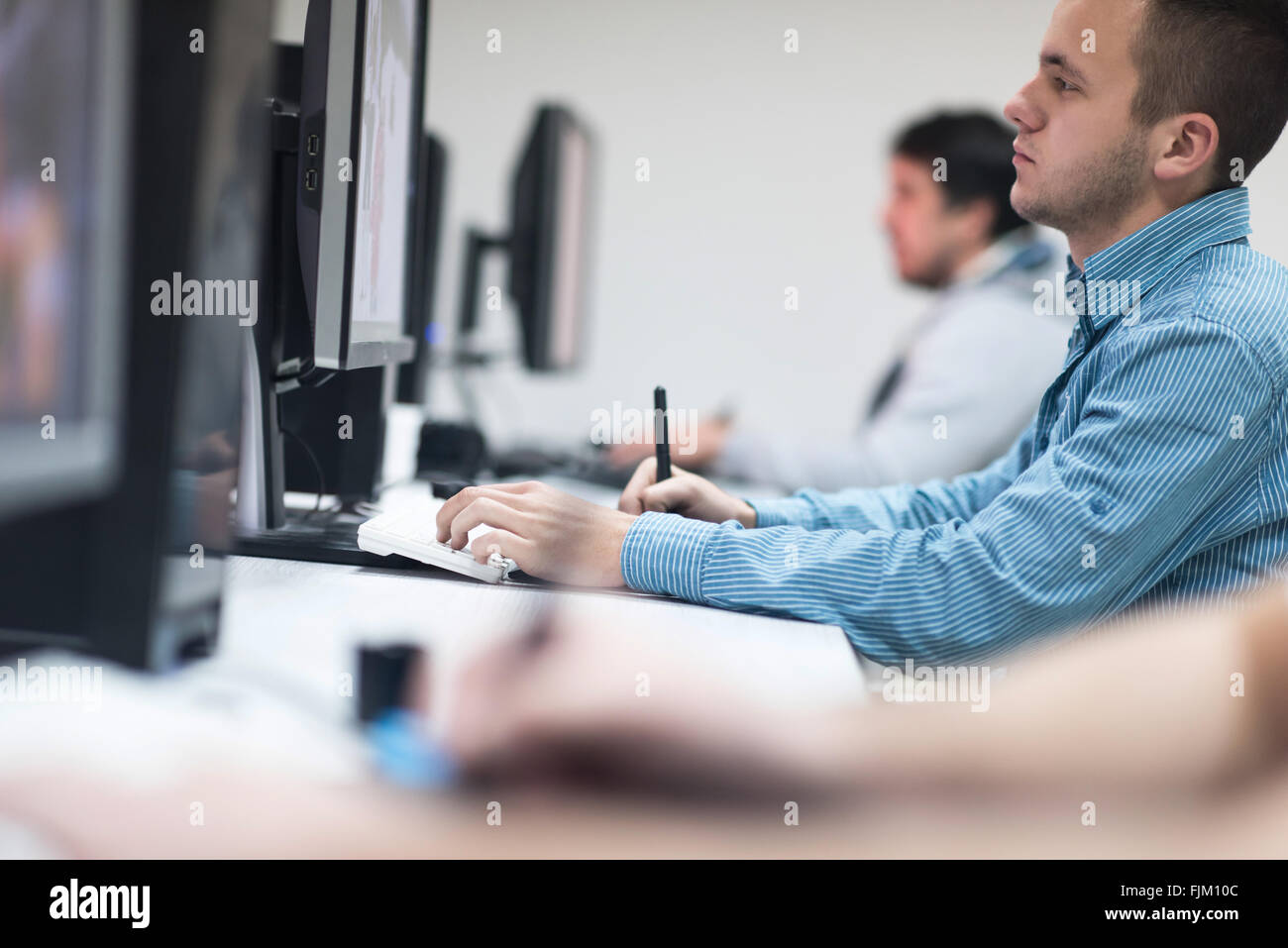 Group photo editors working hi-res stock photography and images - Alamy