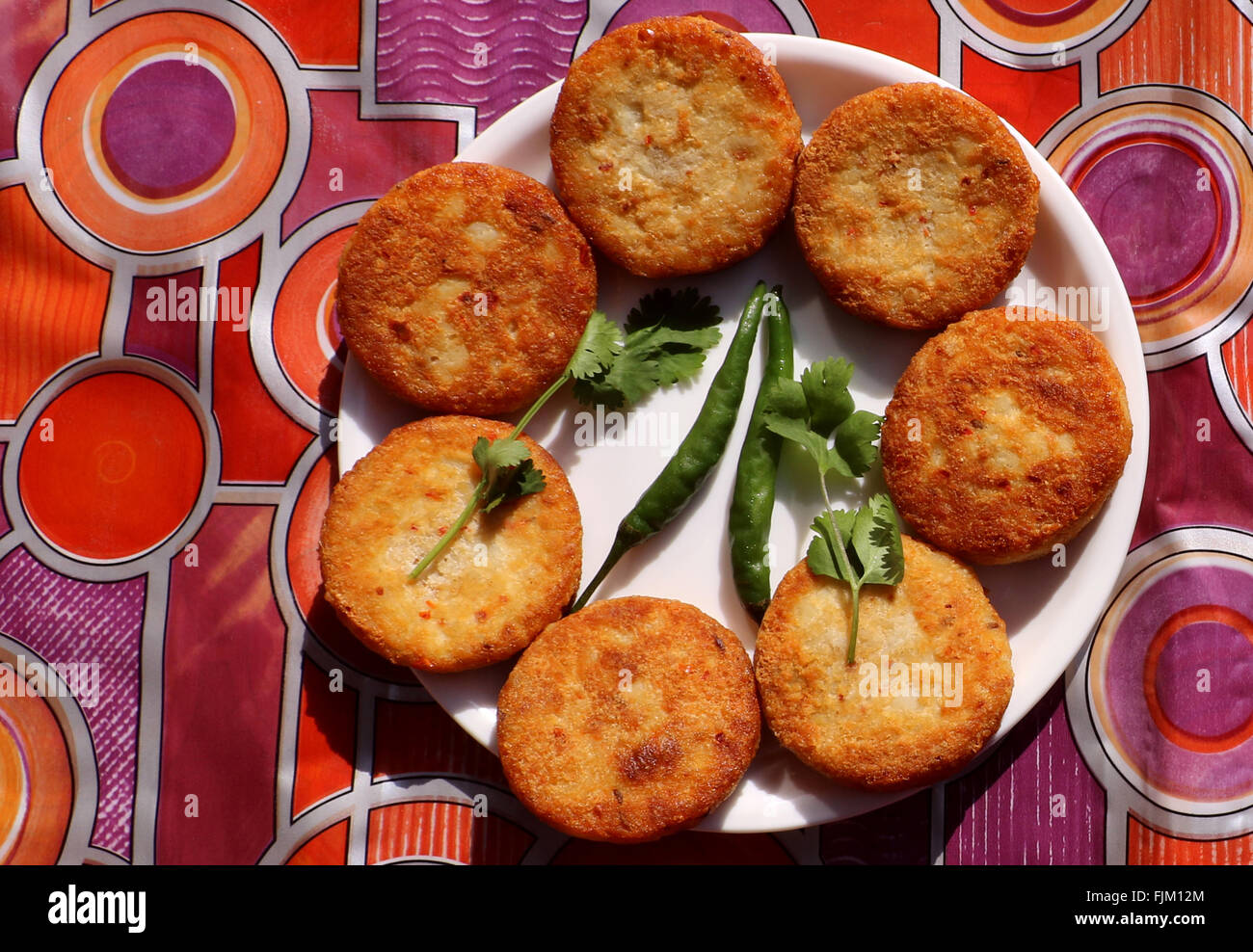 Aloo Tikki or Fried Potato Patties; a popular Indian snack served with ...