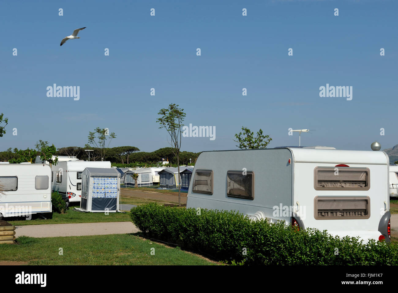 Campers and caravans at a camping in Spain Stock Photo - Alamy
