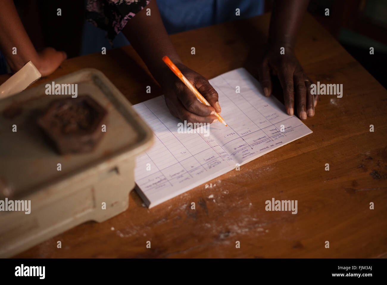 A female business women doing some book keeping, Tanzania Stock Photo ...
