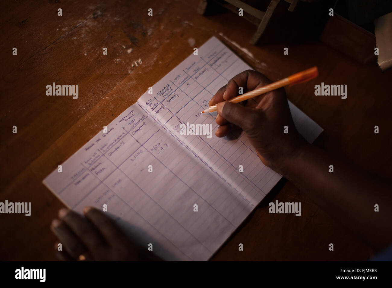 A female business women doing some book keeping, Tanzania Stock Photo ...
