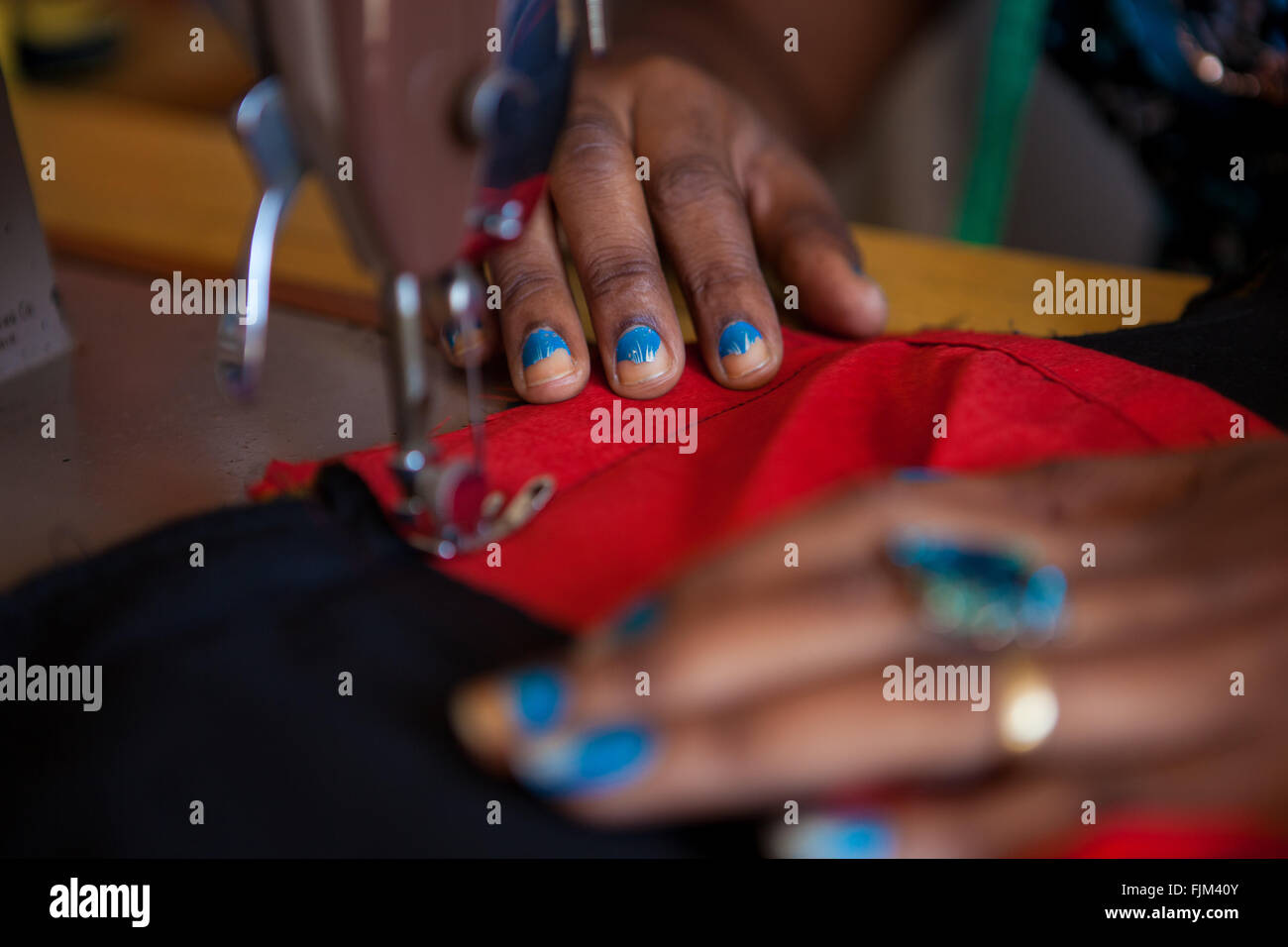 Tailor sewing cloth female hi-res stock photography and images - Alamy