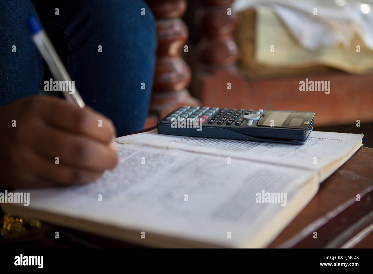 A business women doing some book keeping, Tanzania Stock Photo - Alamy