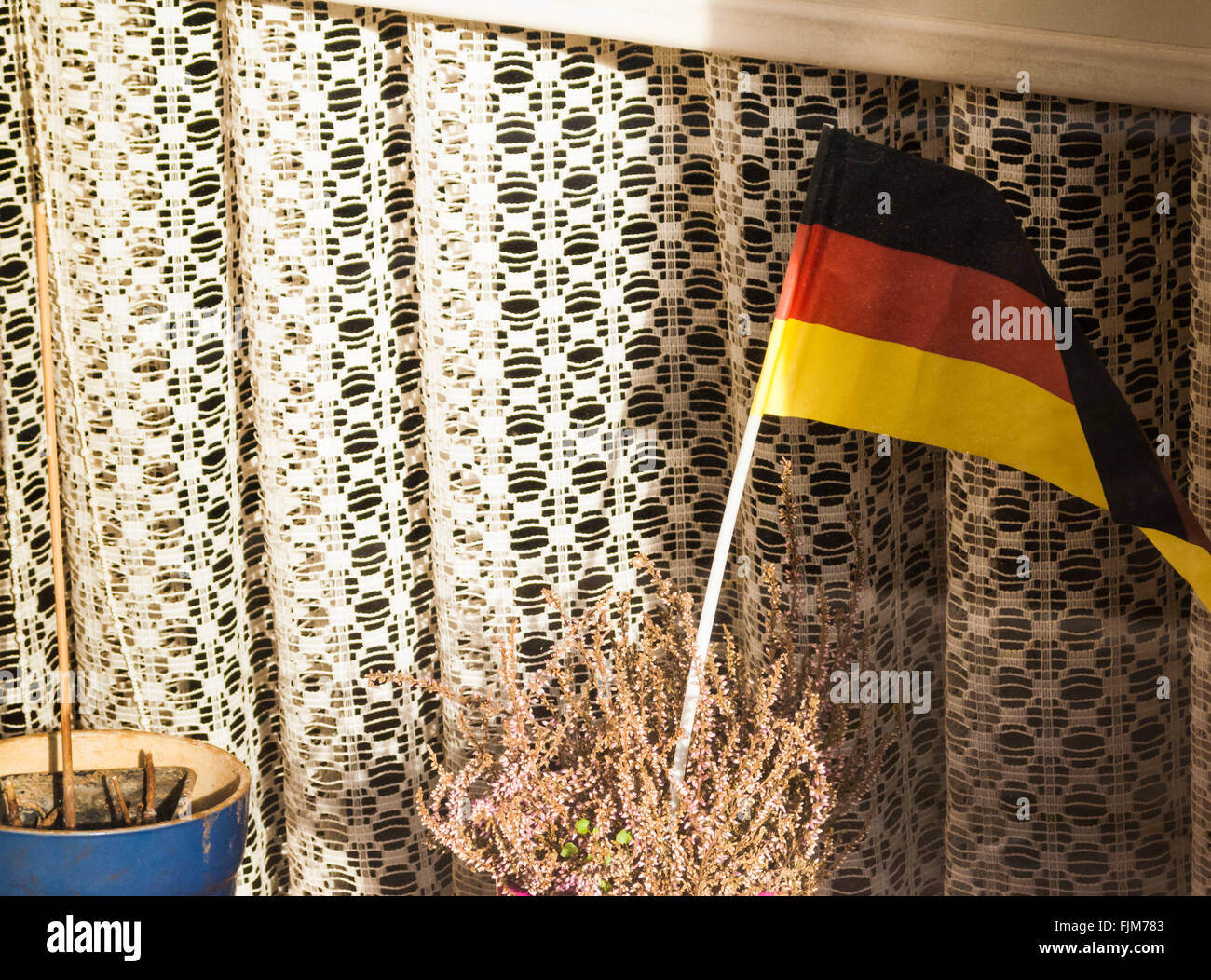 german flag and withered plants on a windowsill Stock Photo - Alamy