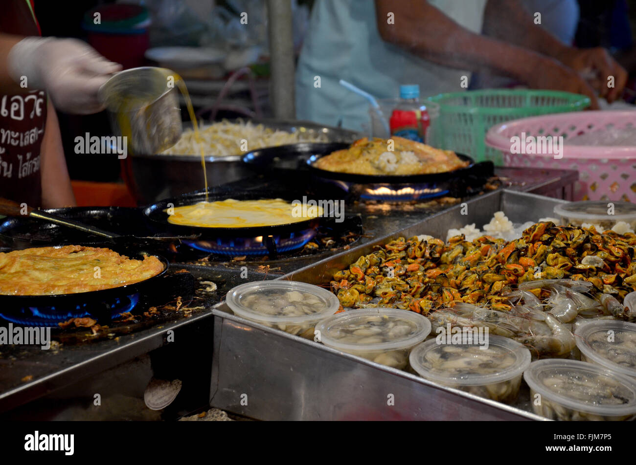 Thai people cooking Fried mussel with egg and crispy flour or Oyster ...