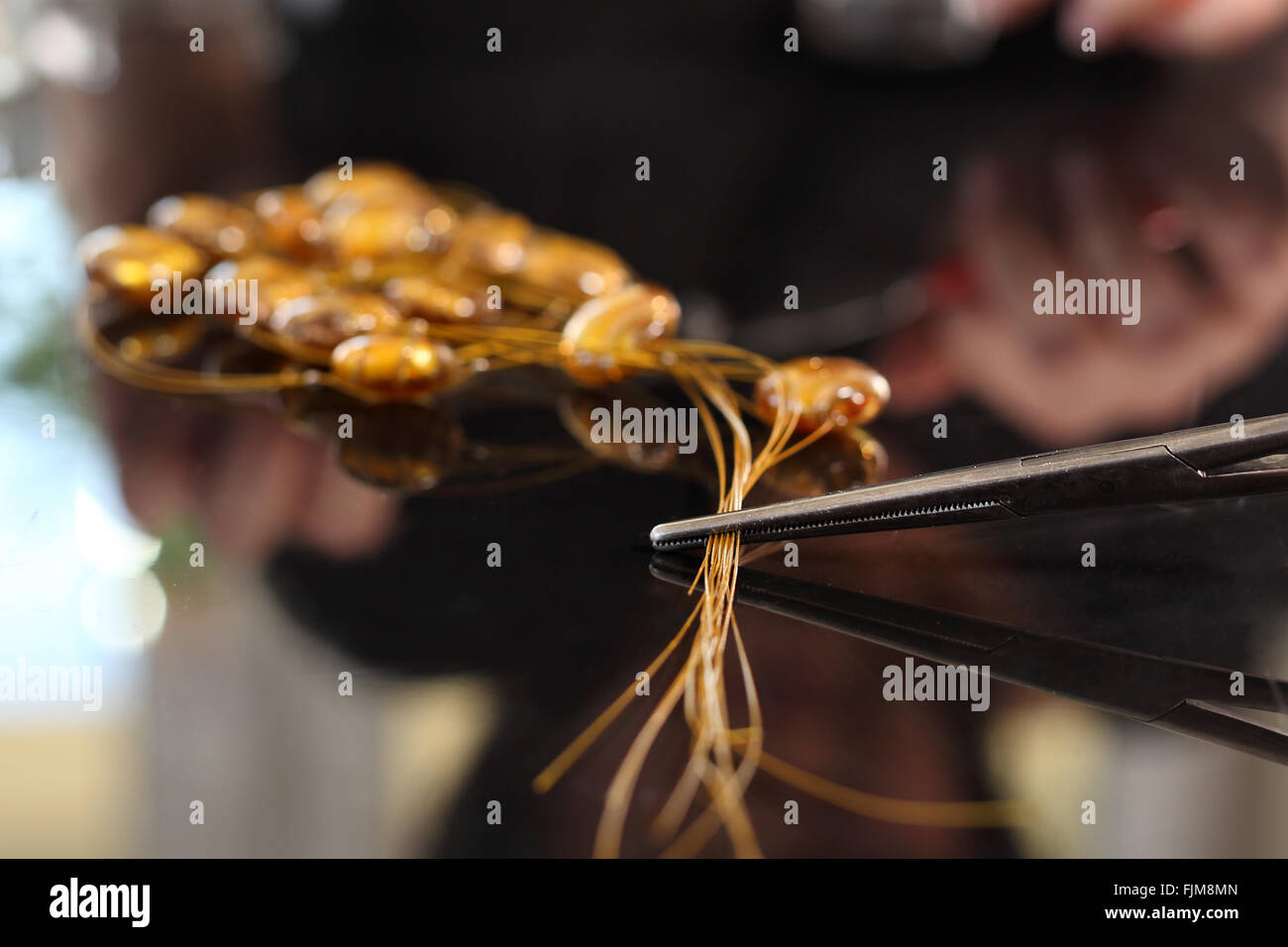Manufactory, a woman carries jewelry made of amber. Create an amber ...