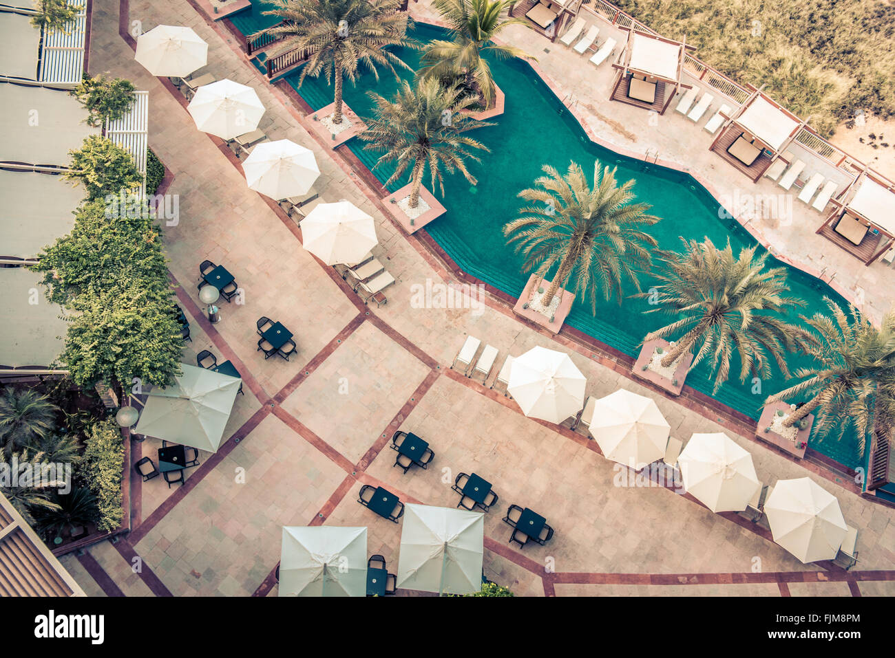 Hotel Poolside with Parasols and Palms. Top view shot Stock Photo - Alamy