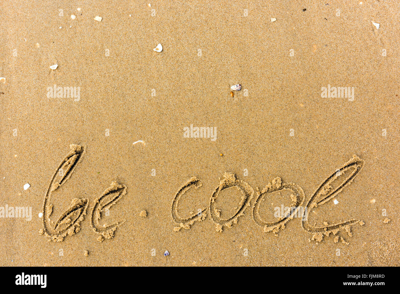 Be cool written on the beach. sand background Stock Photo - Alamy