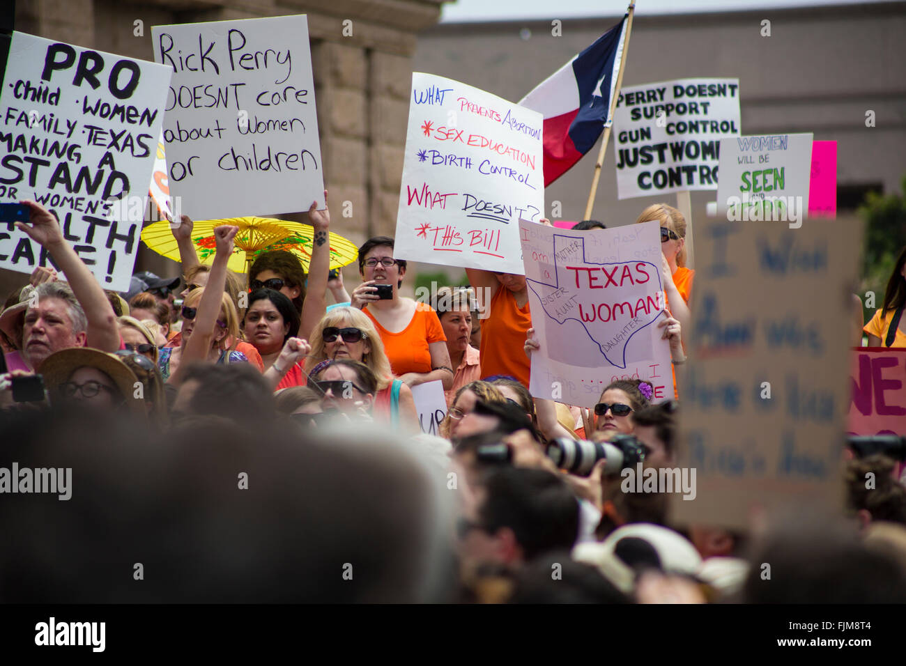 Protesters gather with signs outside the Texas State capital in Austin ...