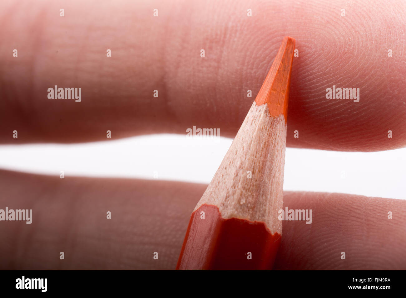 Hand holding color pencil on a white background Stock Photo - Alamy