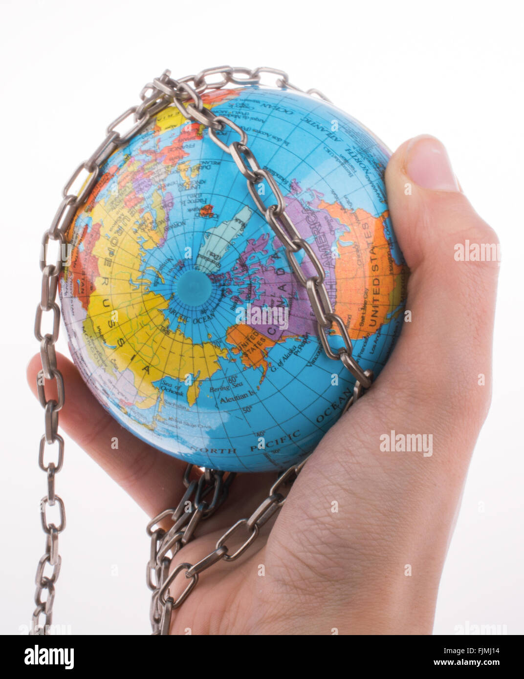 Globe in chain on a white background Stock Photo - Alamy