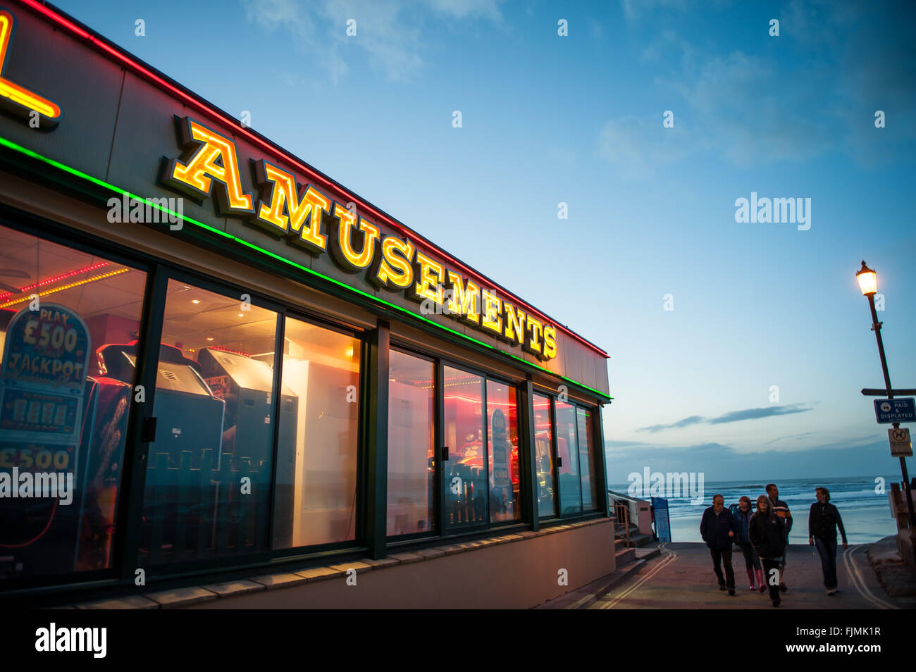 Amusement arcade at sunset at the seaside Stock Photo - Alamy
