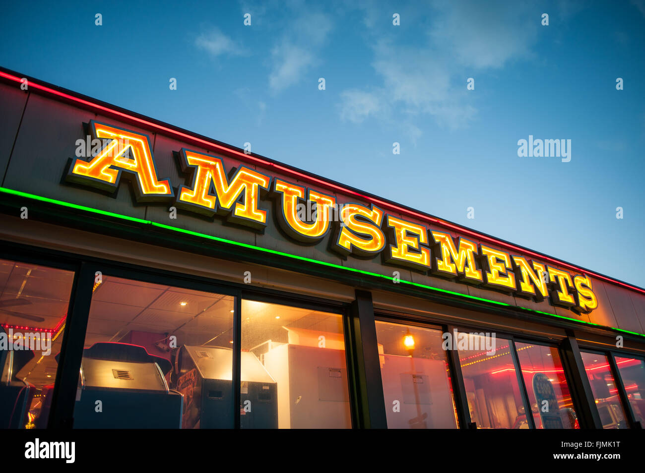 Amusement arcade at sunset at the seaside Stock Photo, Royalty Free ...