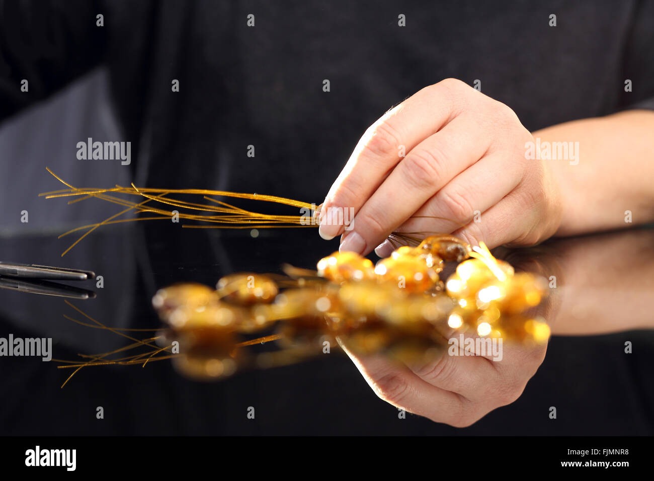 Manufactory, a woman carries jewelry made of amber. Create an amber ...