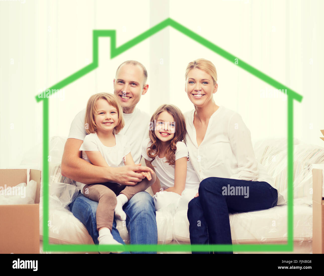 smiling parents and two little girls at new home Stock Photo - Alamy