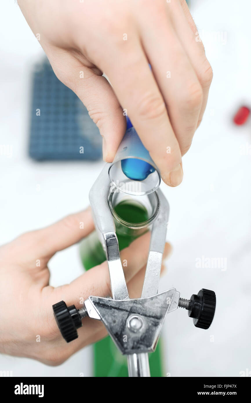close up of scientist filling test tubes in lab Stock Photo - Alamy
