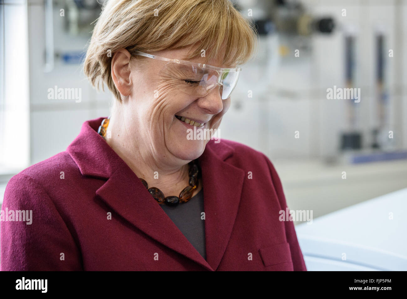 German Chancellor Angela Merkel smiles as she tours an analytical ...