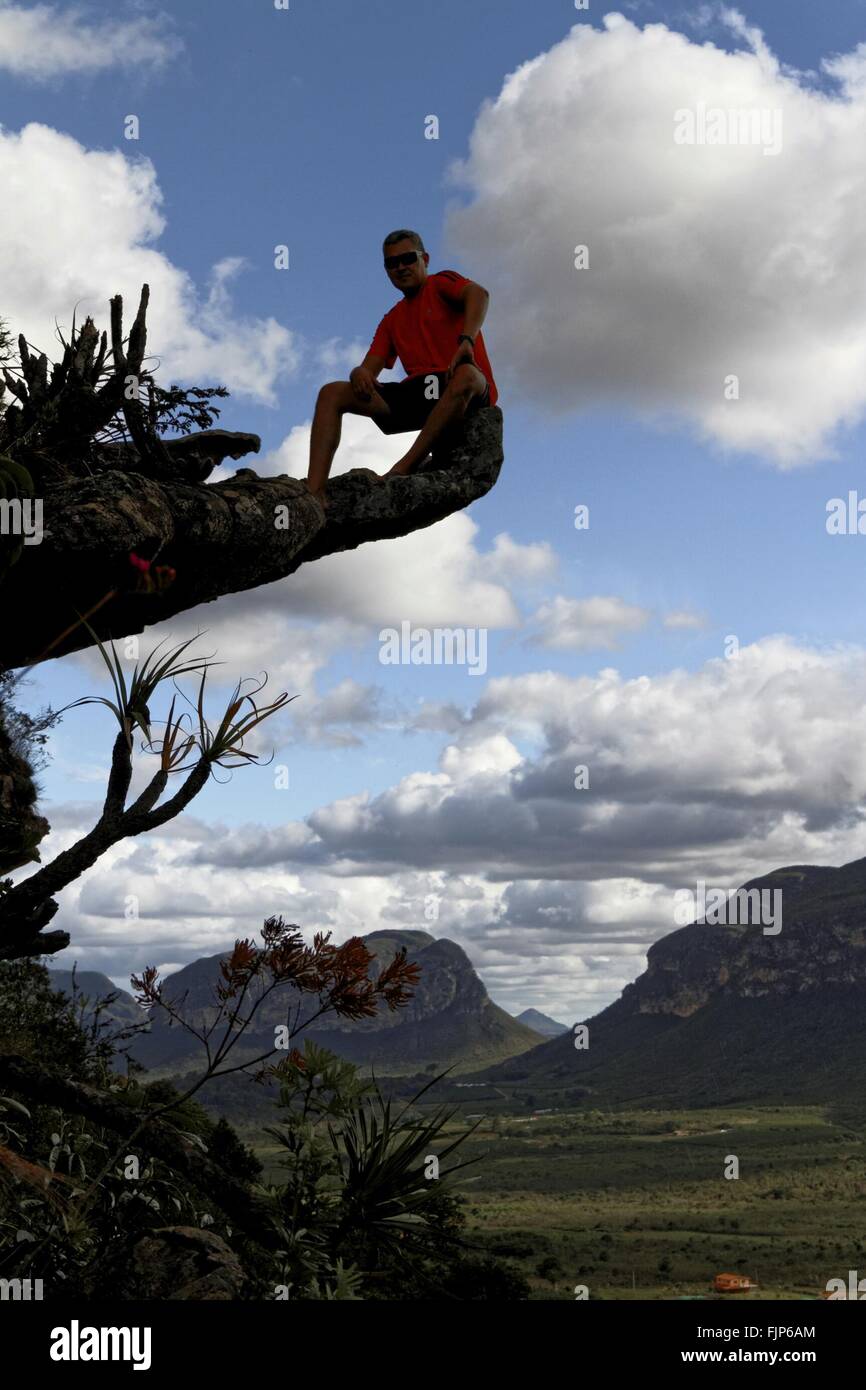 Man Sitting On Tree Stock Photo - Alamy