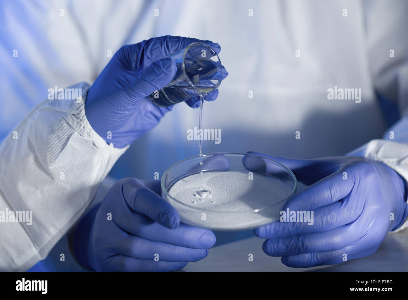 close up of scientists hands with chemicals in lab Stock Photo - Alamy
