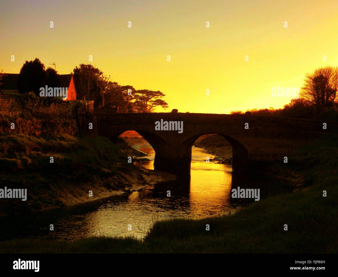 Arch Bridge On River Stock Photo - Alamy
