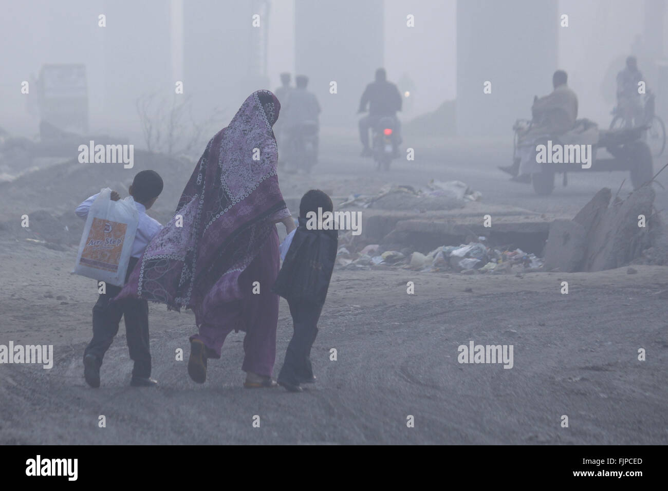 Lahore, Pakistan. 02nd Mar, 2016. Pakistani people passing through ...
