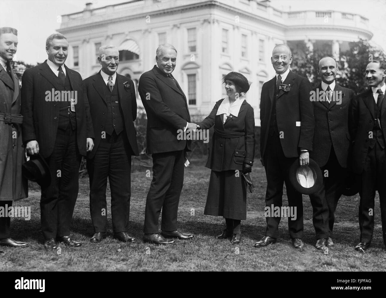 U.S. President Warren G. Harding greeting group of people on White ...