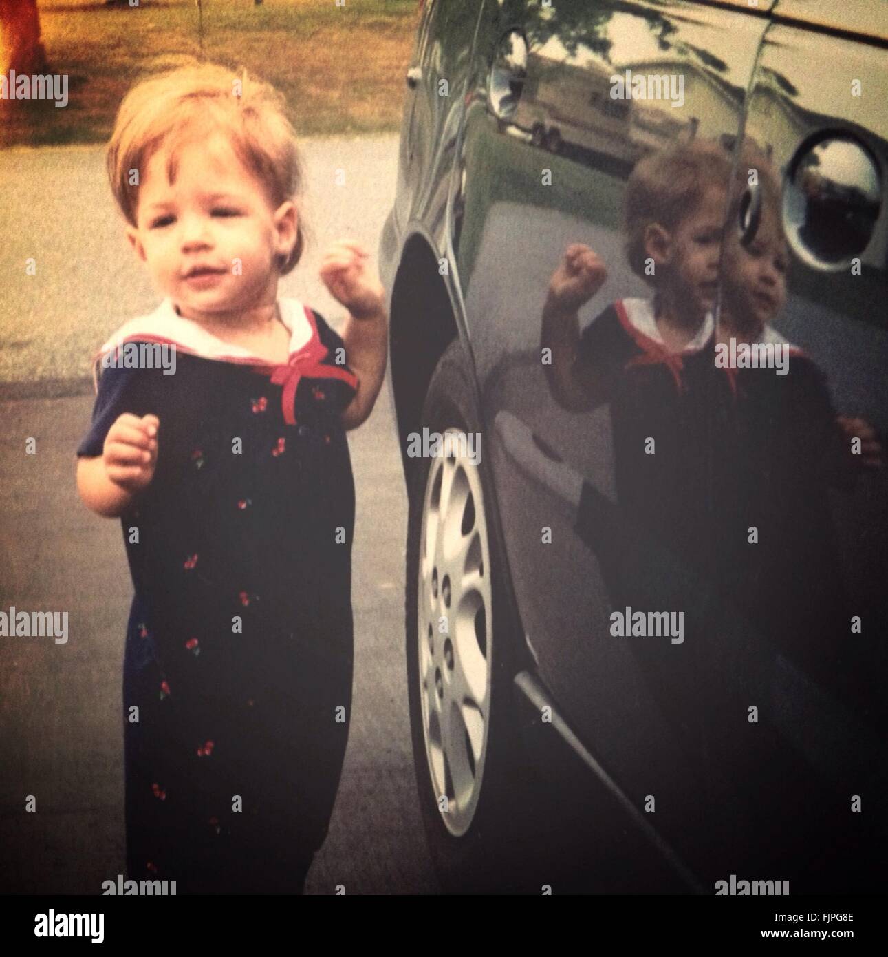 Boy standing near car boys hi-res stock photography and images - Alamy