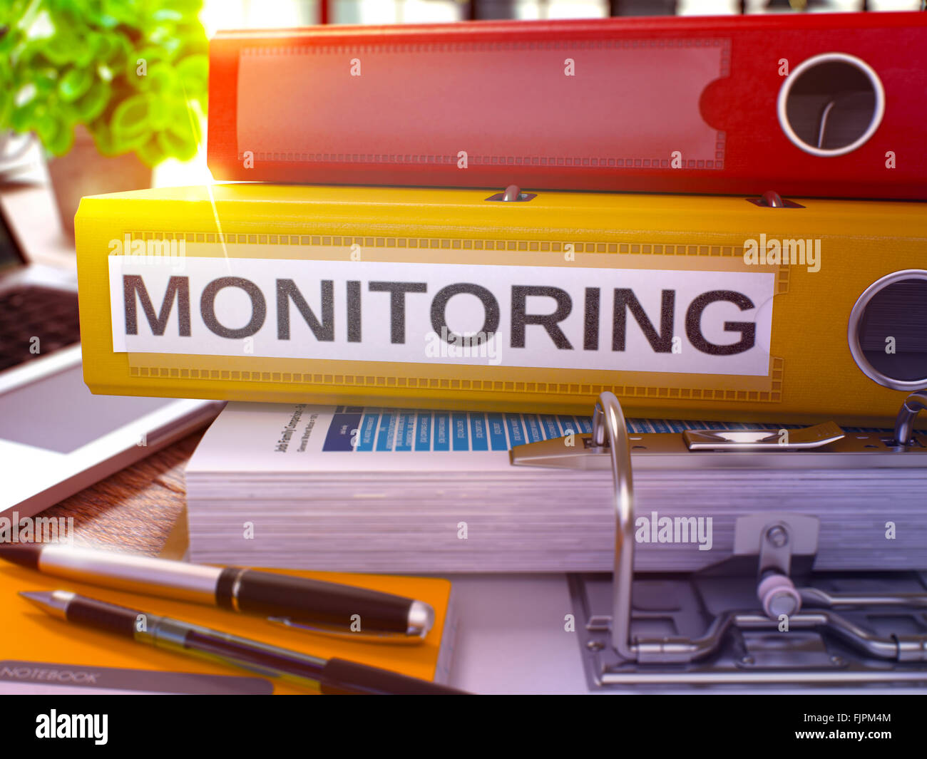 Monitoring on Yellow Ring Binder. Blurred, Toned Image Stock Photo - Alamy