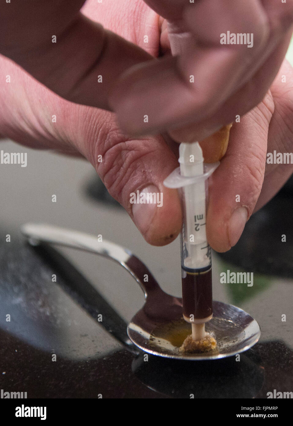 37-year-old drug addict Marc (name altered upon request) fills a ...