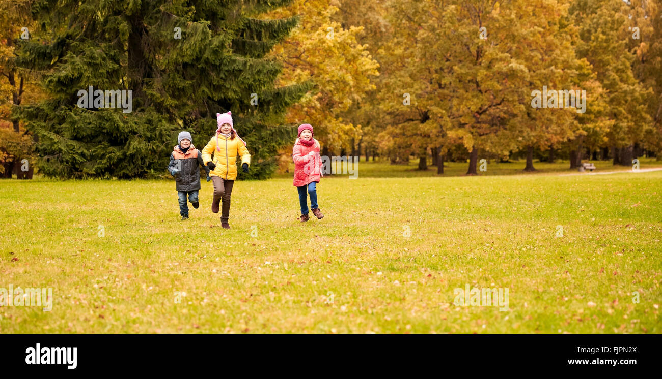 group of happy little kids running outdoors Stock Photo - Alamy
