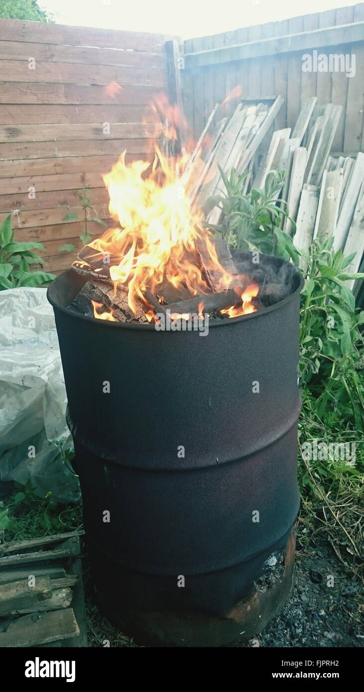 Fire In Container At Back Yard Stock Photo - Alamy