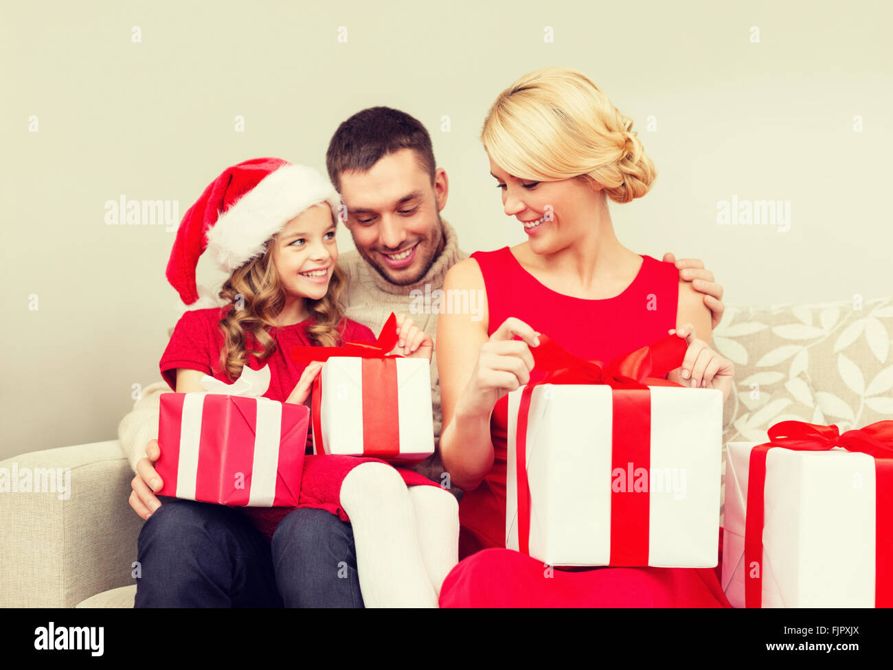 happy family opening gift boxes Stock Photo - Alamy