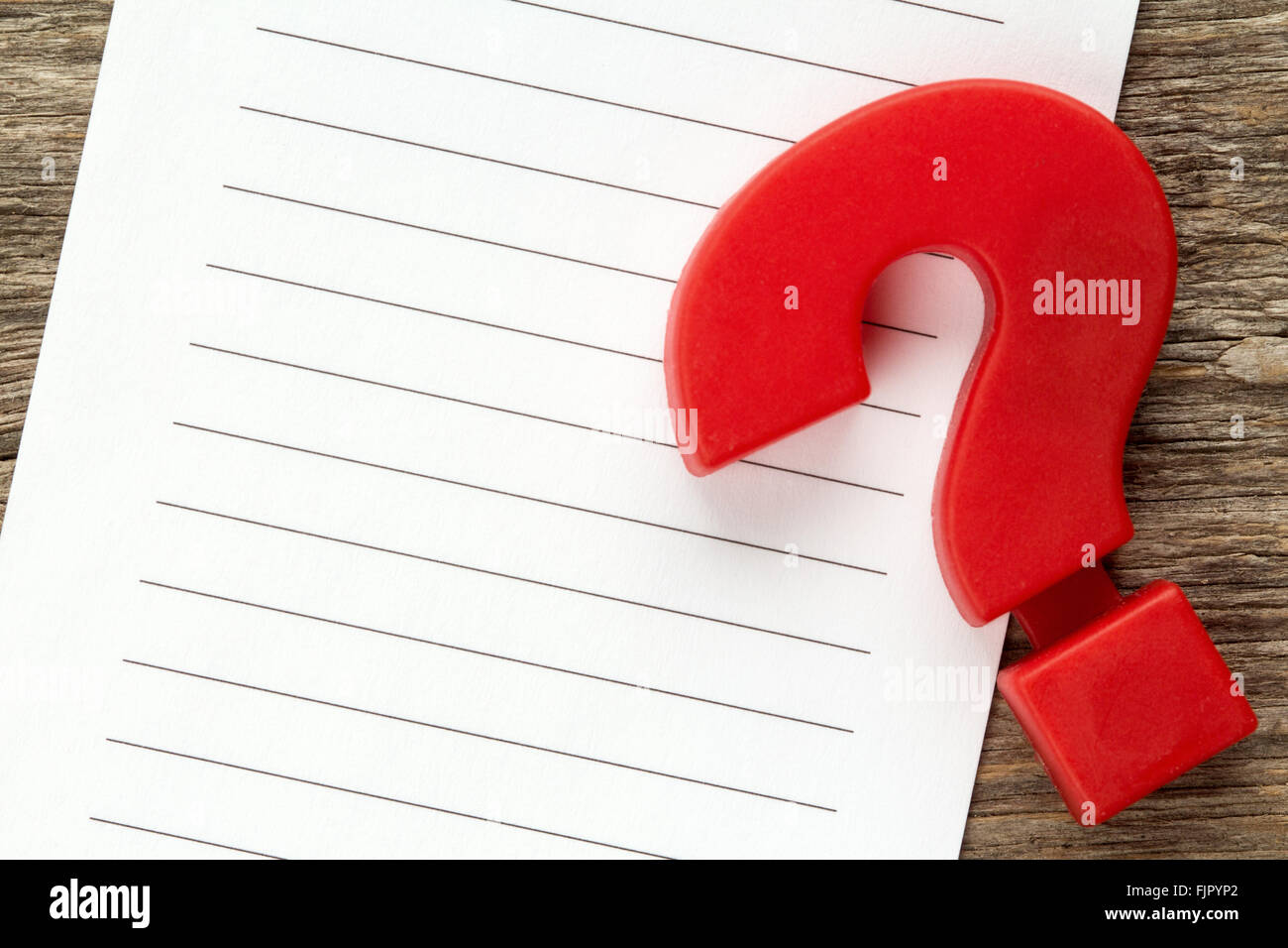 Note paper with red plastic question mark Stock Photo - Alamy Note paper with red plastic question mark Stock Photo - Alamy