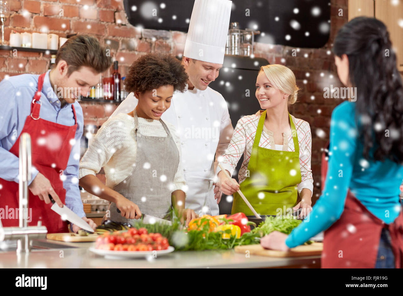 happy friends and chef cook cooking in kitchen Stock Photo - Alamy