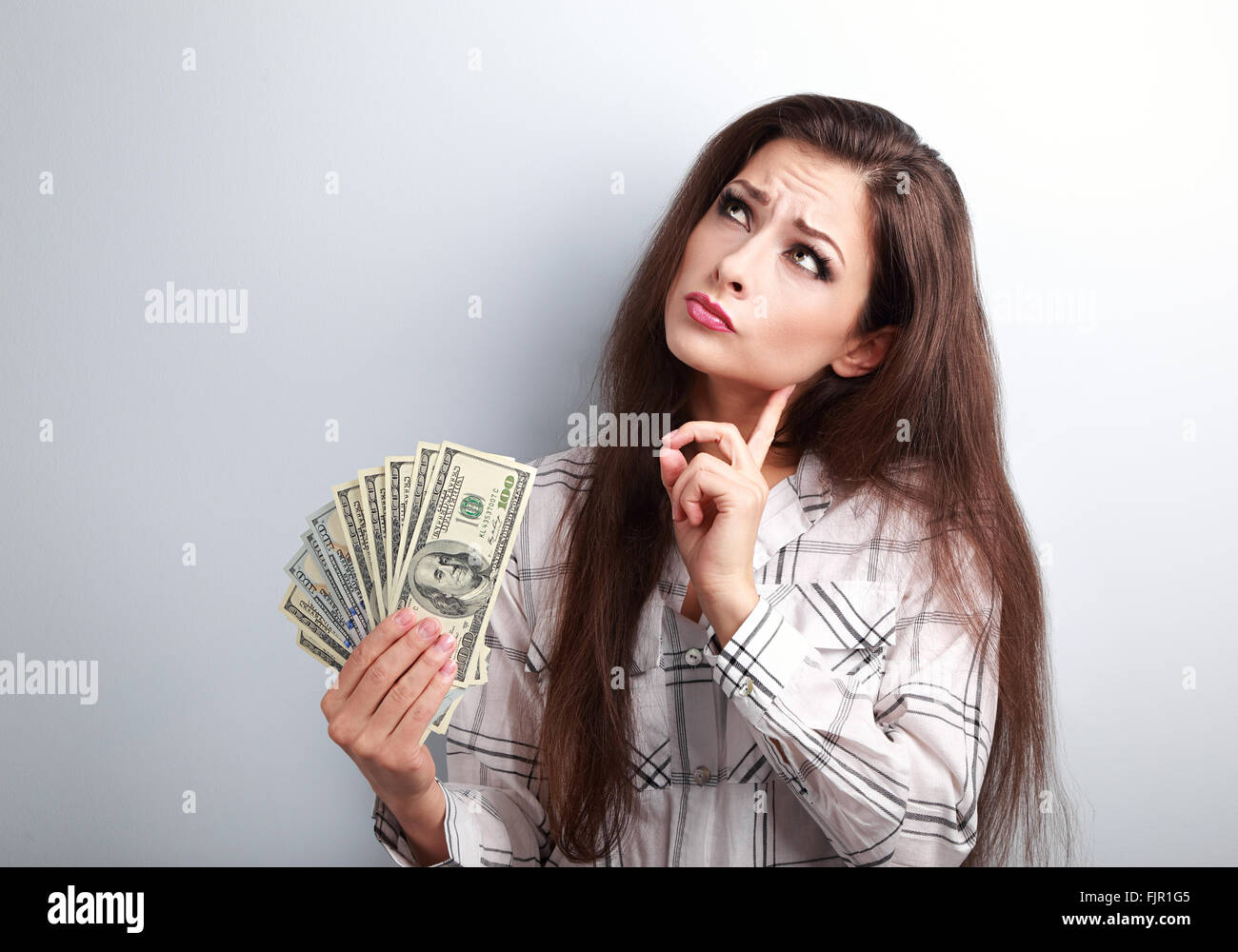 Intelligence business woman in looking up and thinking about money on ...