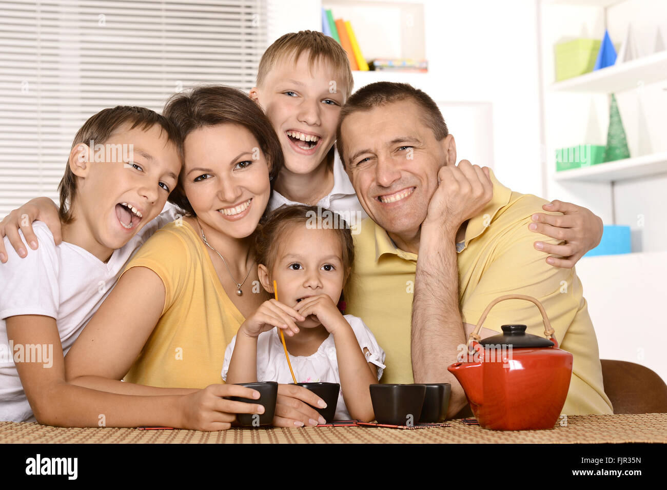 Family drinking tea Stock Photo - Alamy