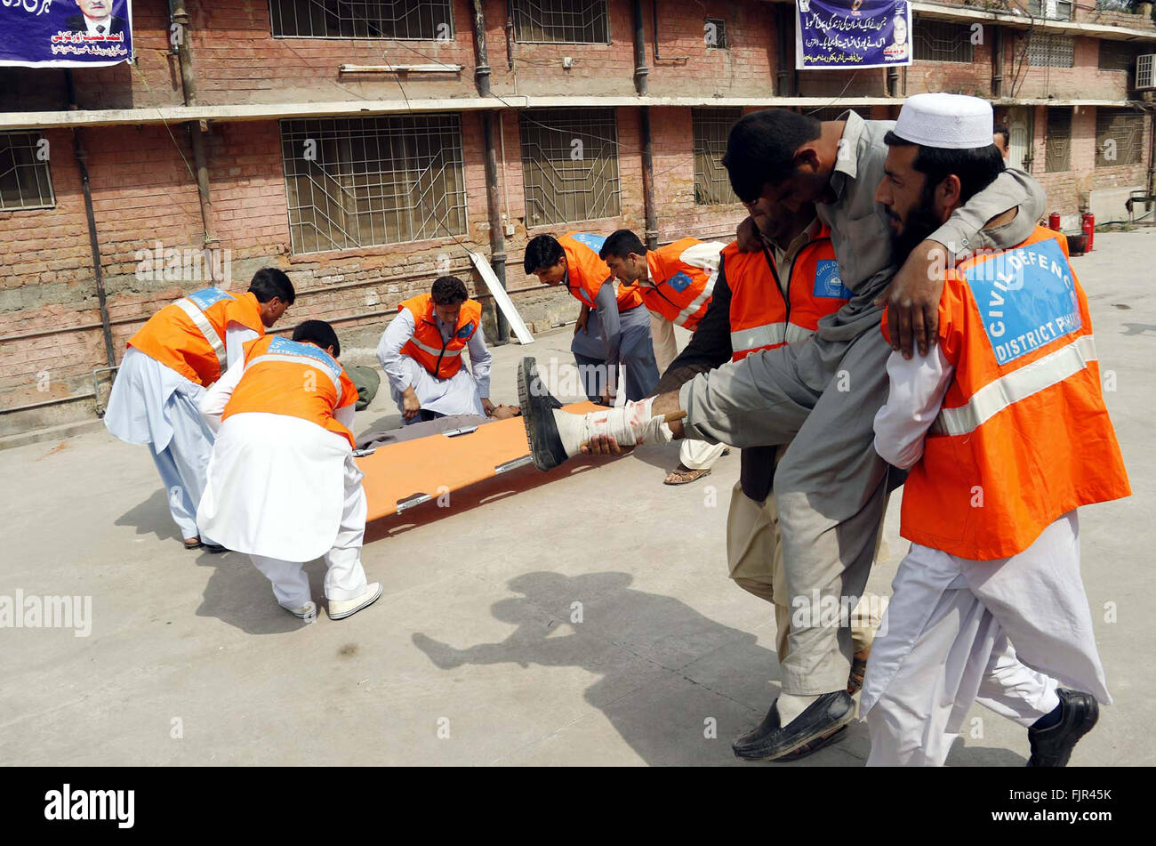 Rescue officials take part in a demonstration to show their ...