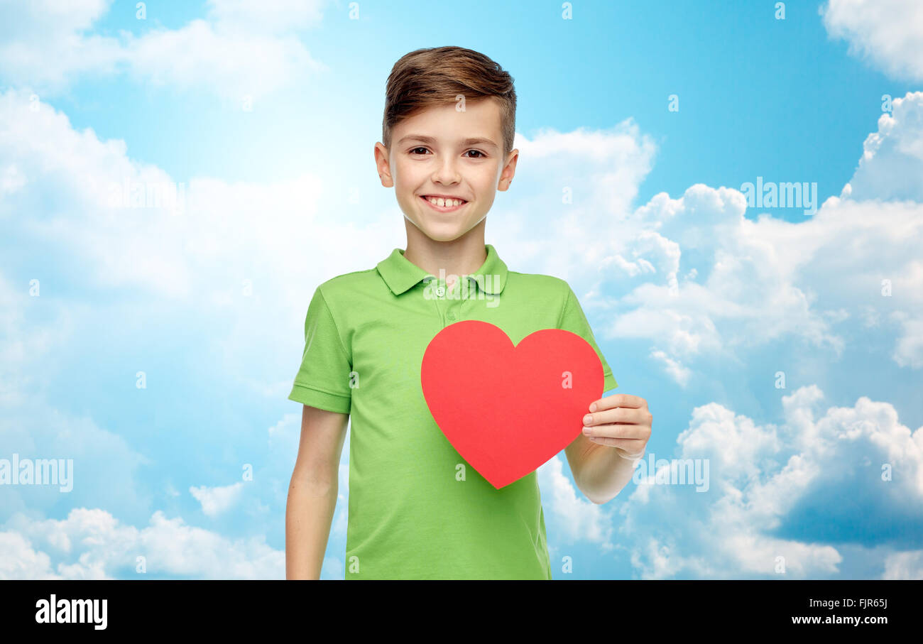 happy boy holding red heart shape Stock Photo - Alamy
