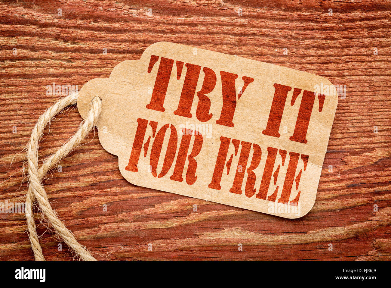 Try it for free offer - red stencil text on a paper price tag against ...