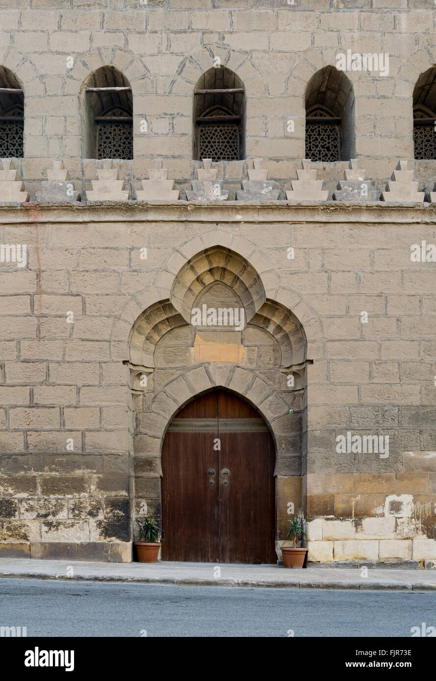 Wooden closed arched door of one of the buildings in the Citadel of ...