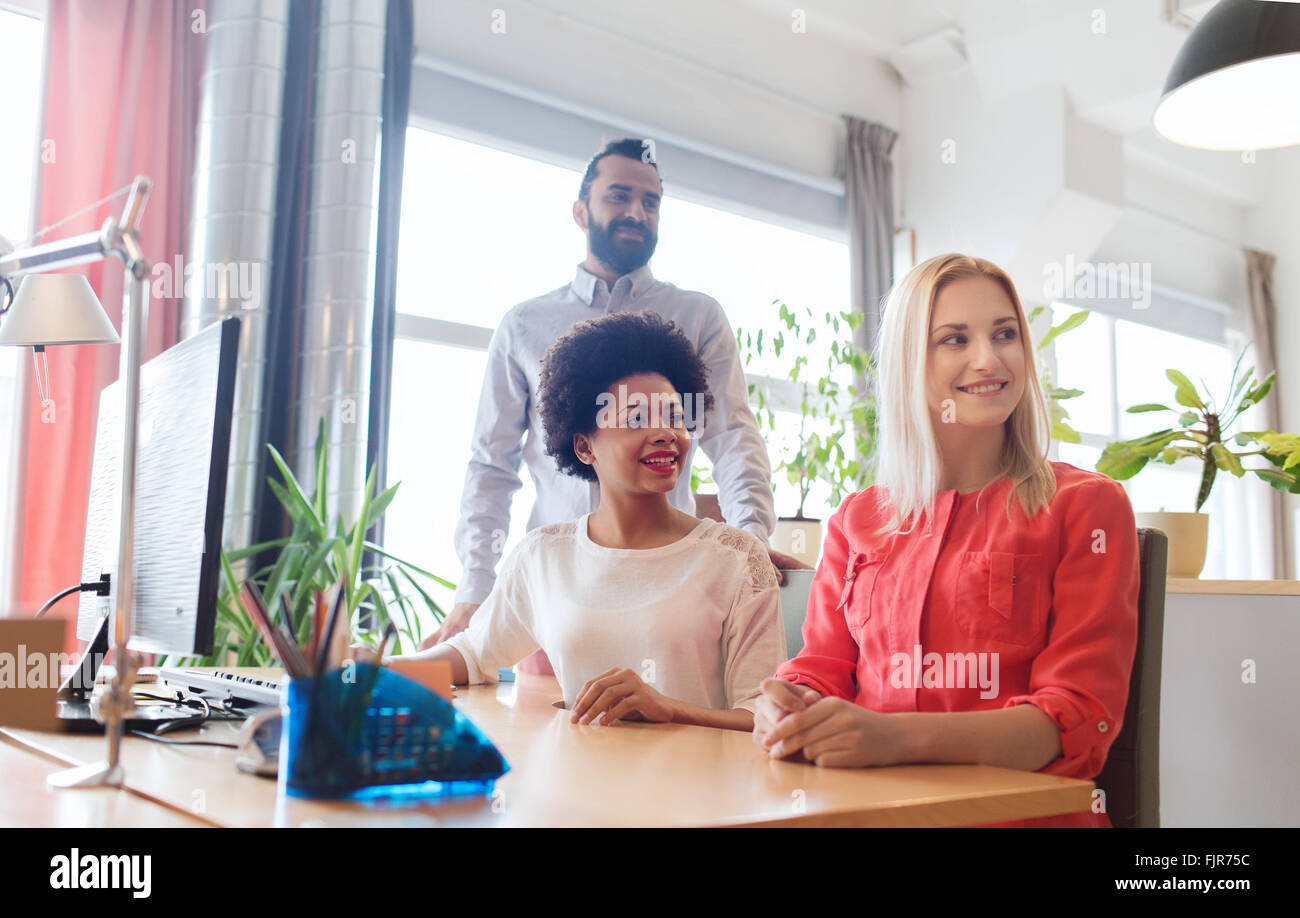happy creative team in office Stock Photo - Alamy