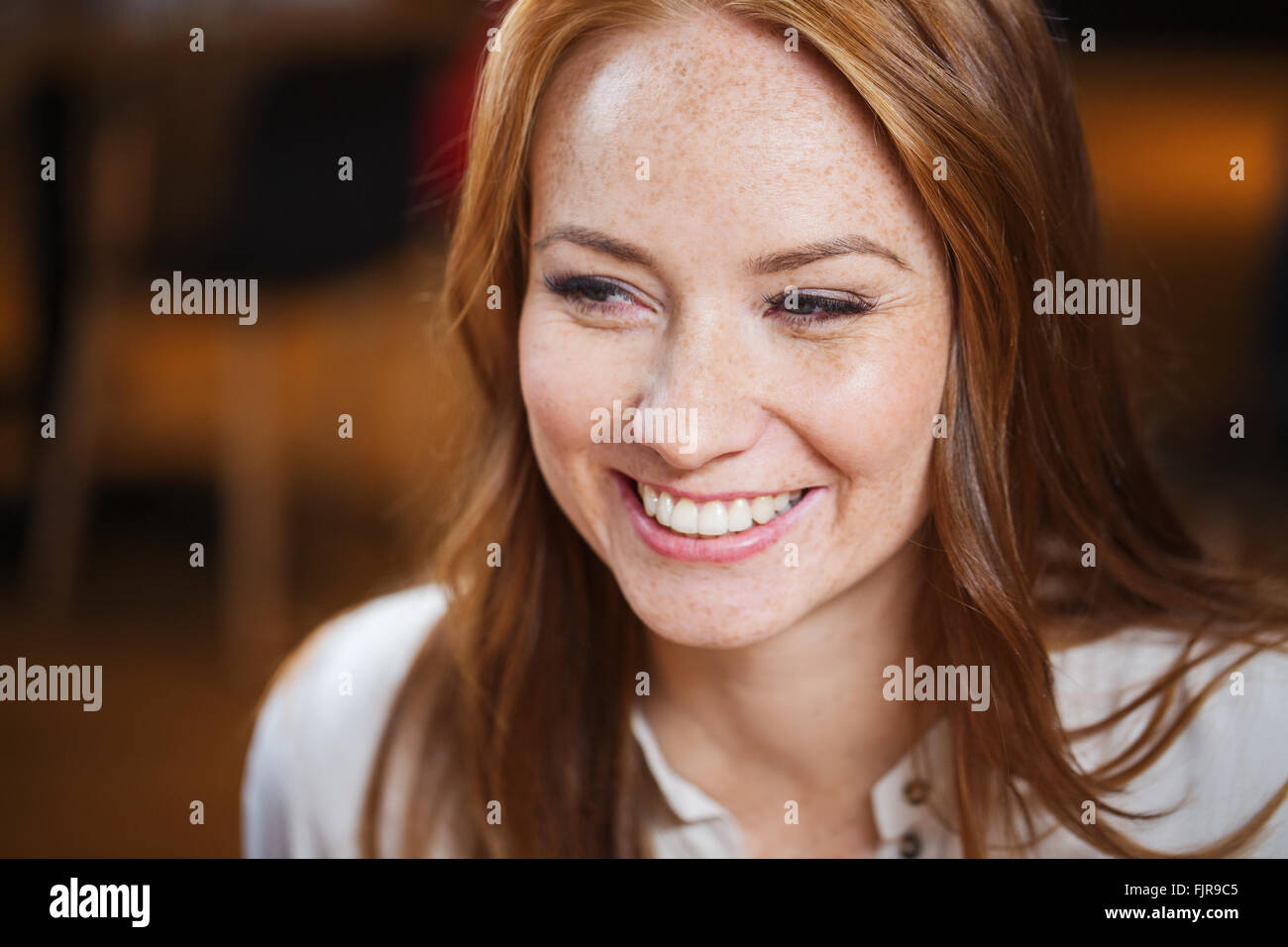 smiling happy young redhead woman face Stock Photo - Alamy