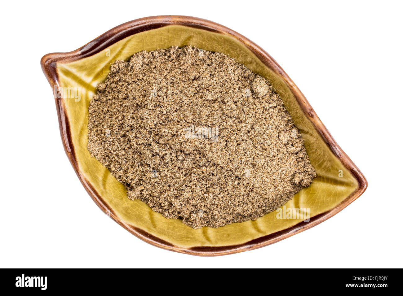 chia seed flour in a ceramic leaf shaped bowl isolated on white, top ...