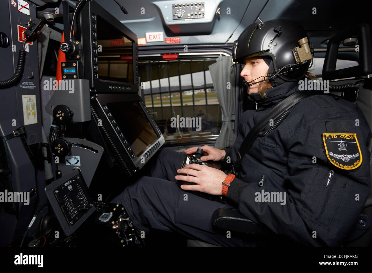 Electro-optic system operator Marco Stadel handles the camera system of ...