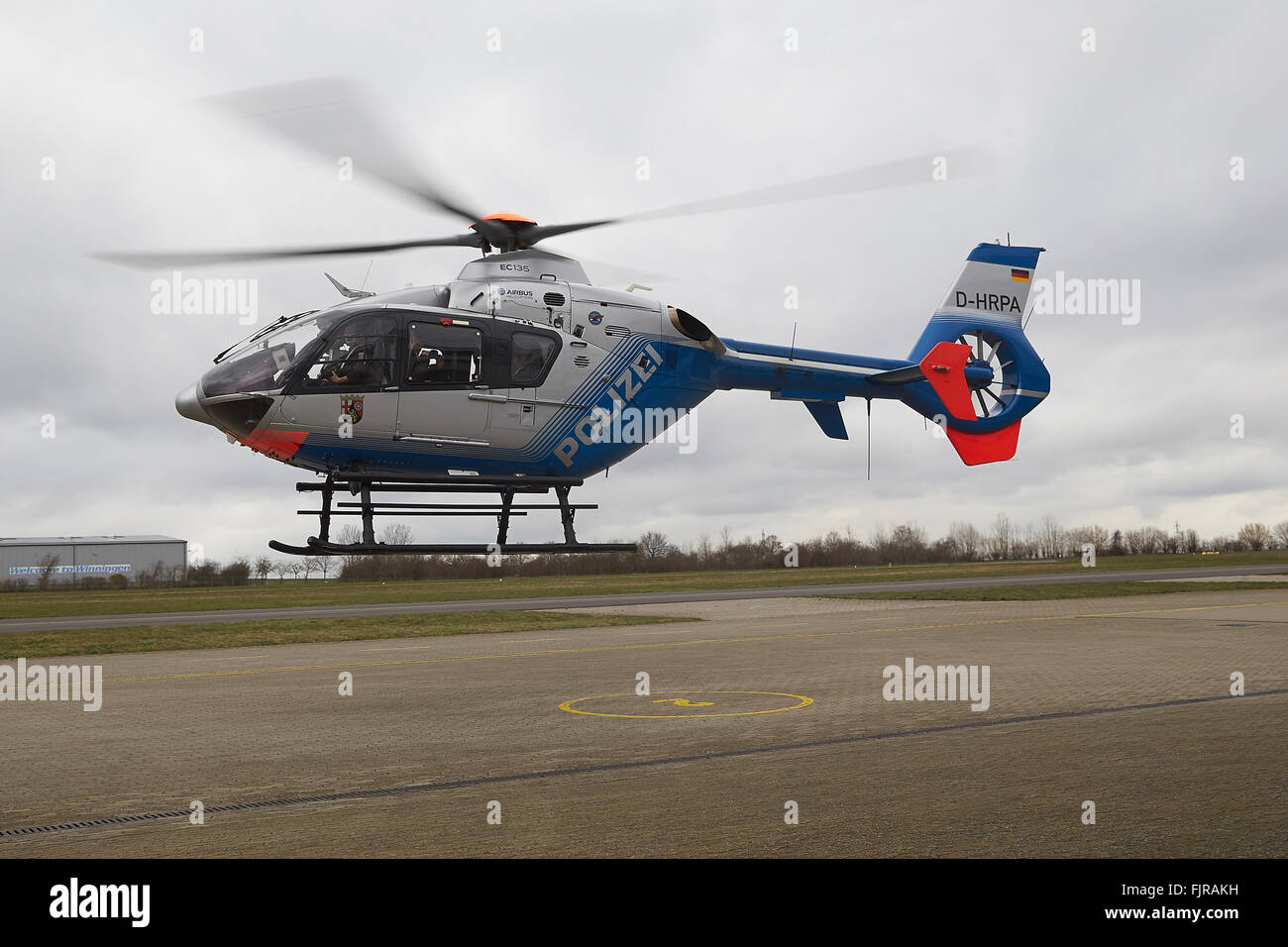A Eurocopter H 135 police helicopter takes off at Winningen airfield ...