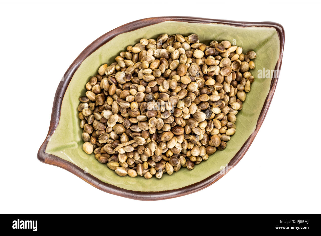 hemp seeds on an isolated leaf shaped ceramic bowl, top view Stock ...