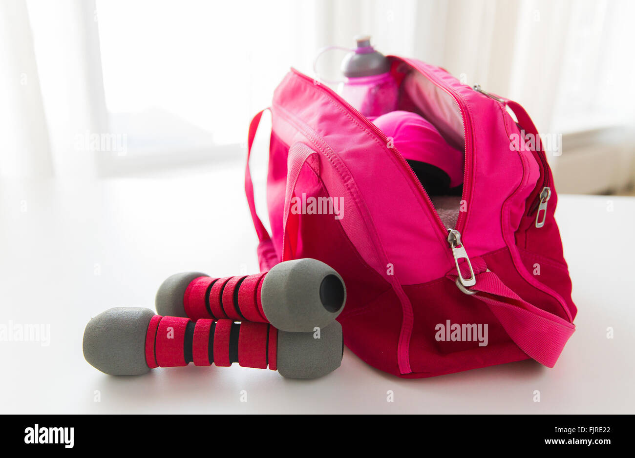 Girl in gym dumbbells hi-res stock photography and images - Alamy